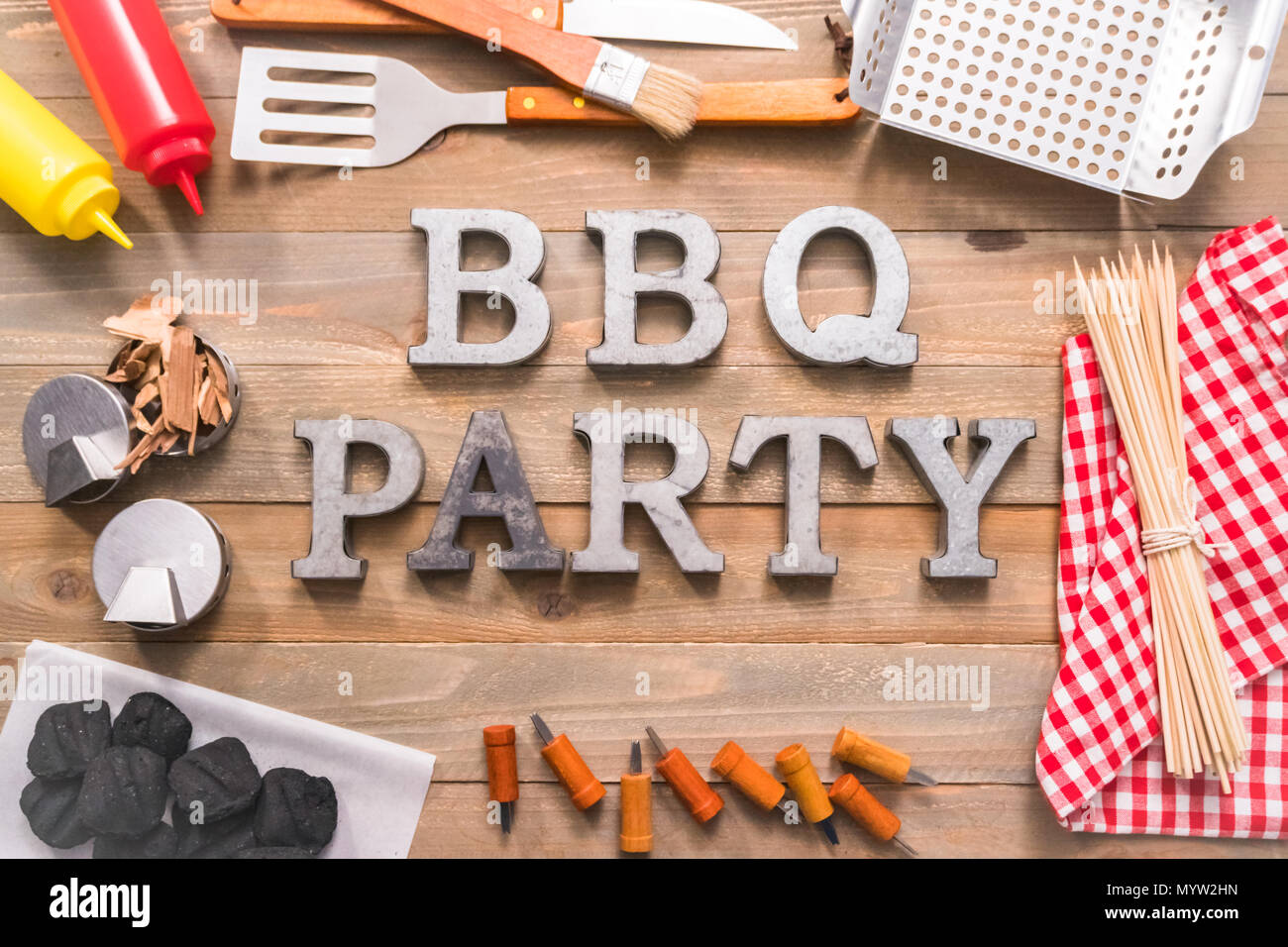 Metal BBQ Party sign with grilling tools on wood background Stock Photo ...