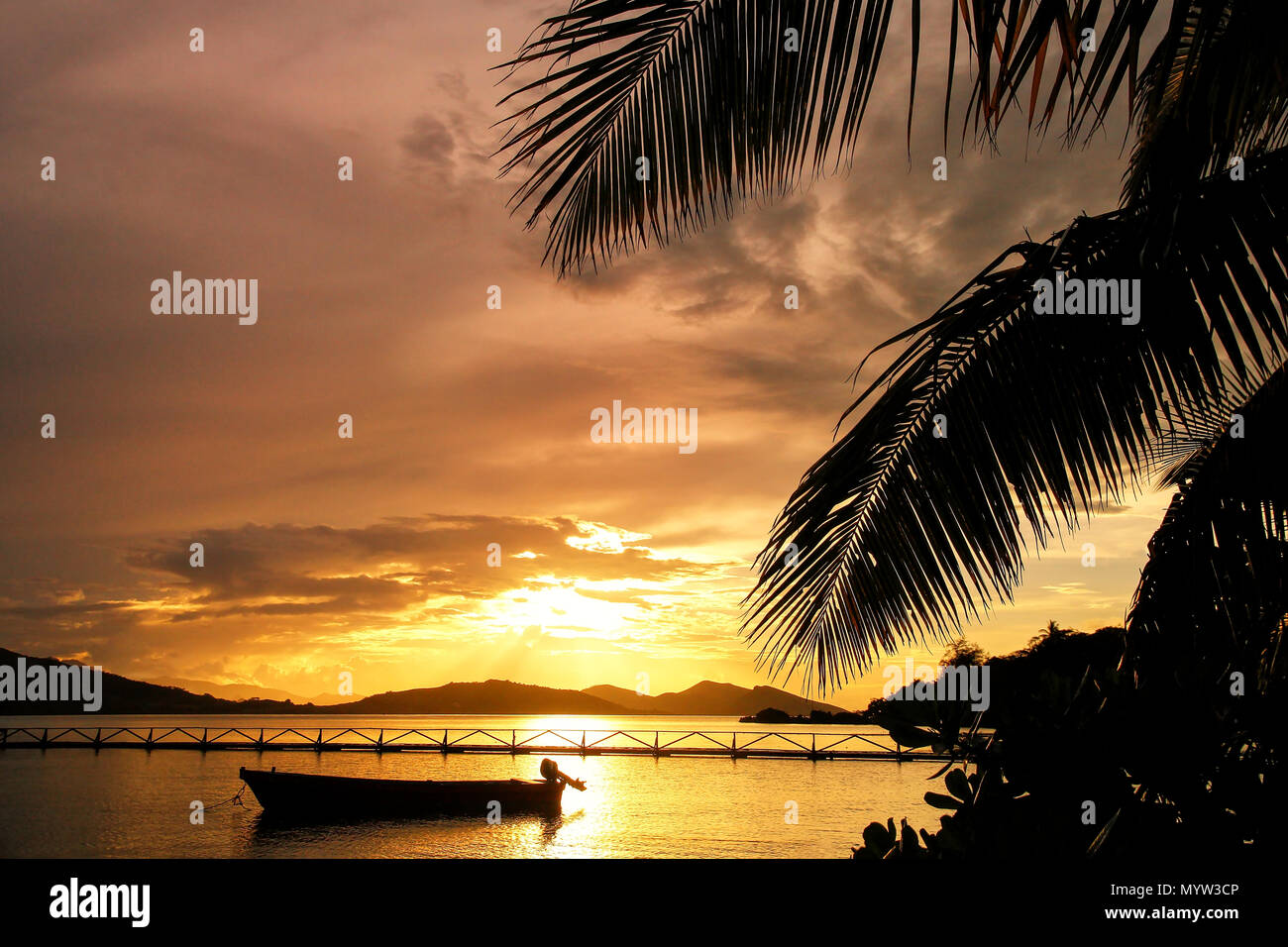 Colorful sunset at Nananu-i-Ra Island, Fiji. Tourism is the main ...