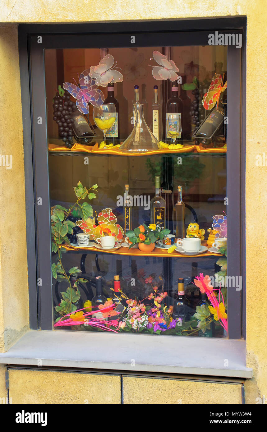 Display of bottles in a window in Montalcino town, Val d'Orcia, Tuscany ...