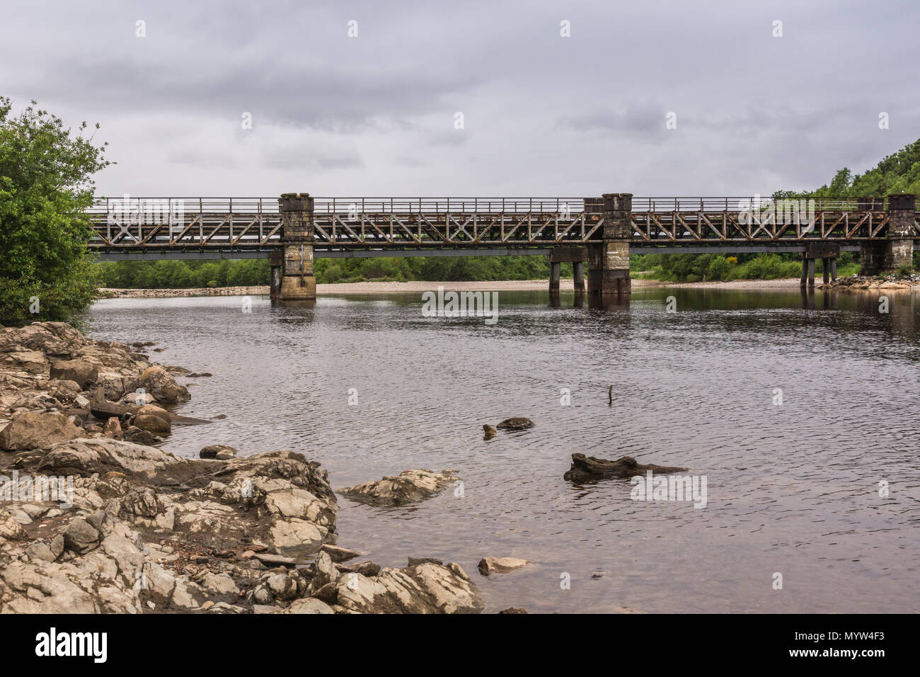Torlundy, Scotland - June 11, 2012: Railway bridge over the gray River ...