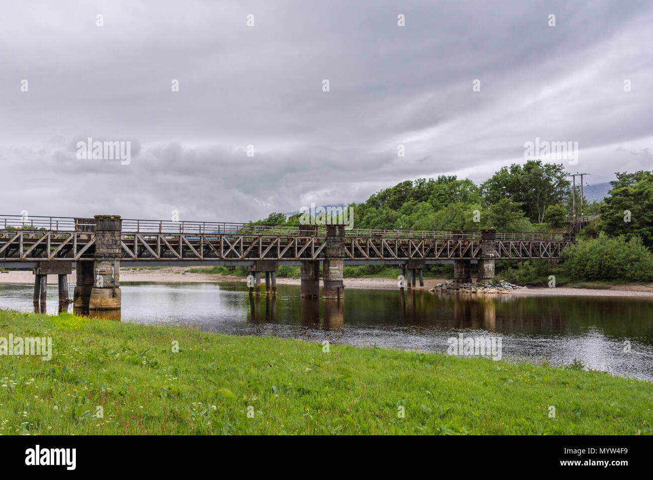 Torlundy, Scotland - June 11, 2012: Railway bridge over the gray River ...