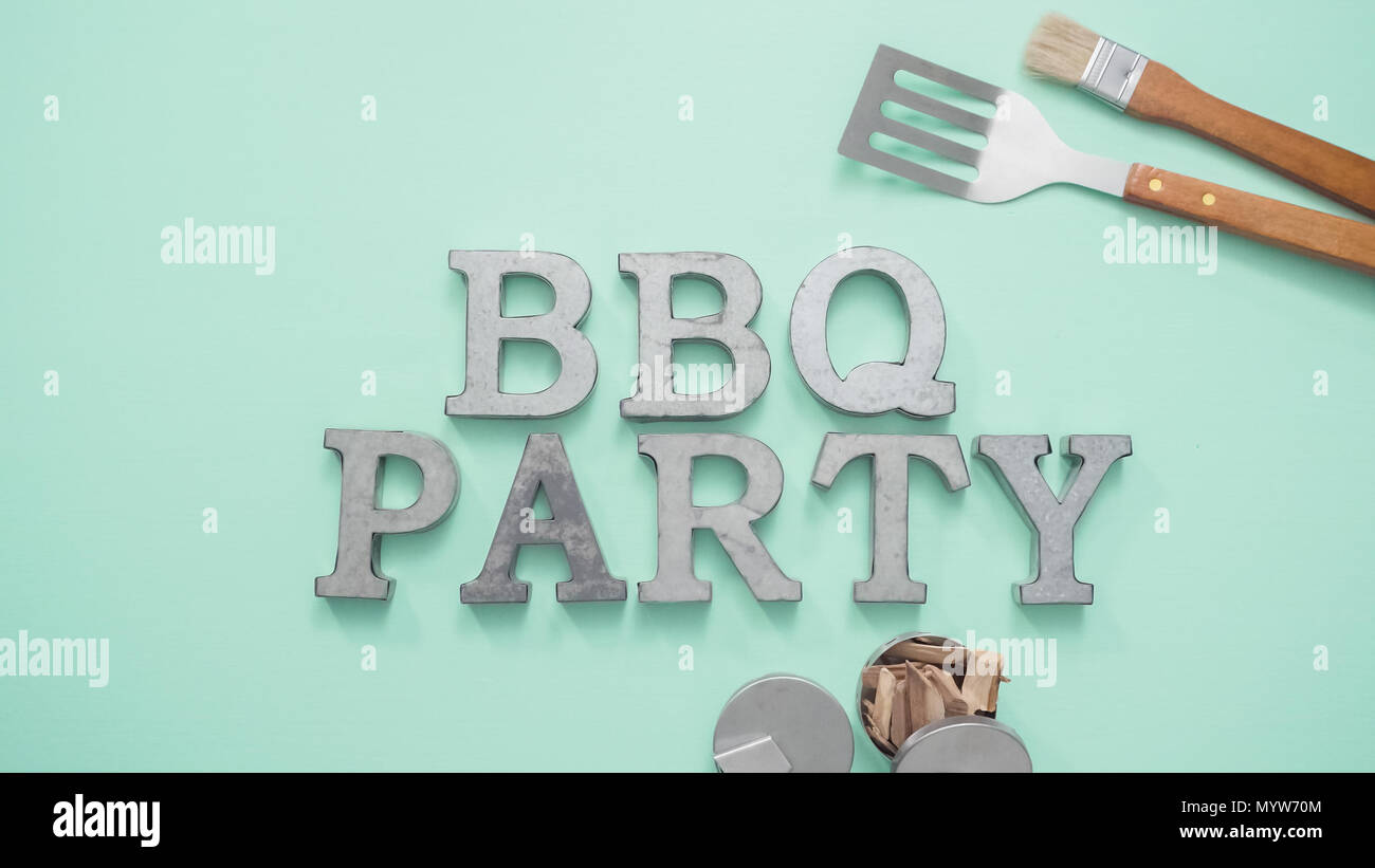 Metal BBQ Party sign with grilling tools on blue background Stock Photo ...