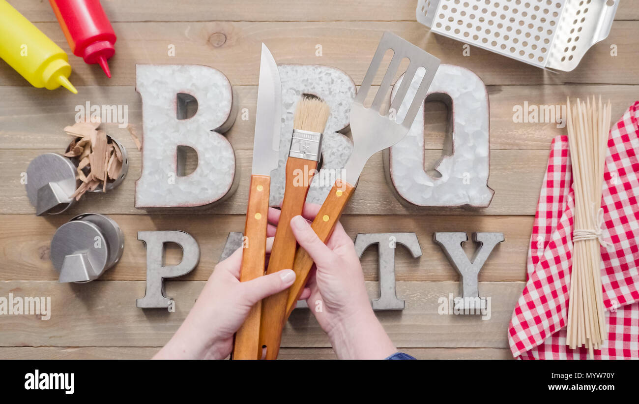 Metal BBQ Party sign with grilling tools on wood background Stock Photo ...