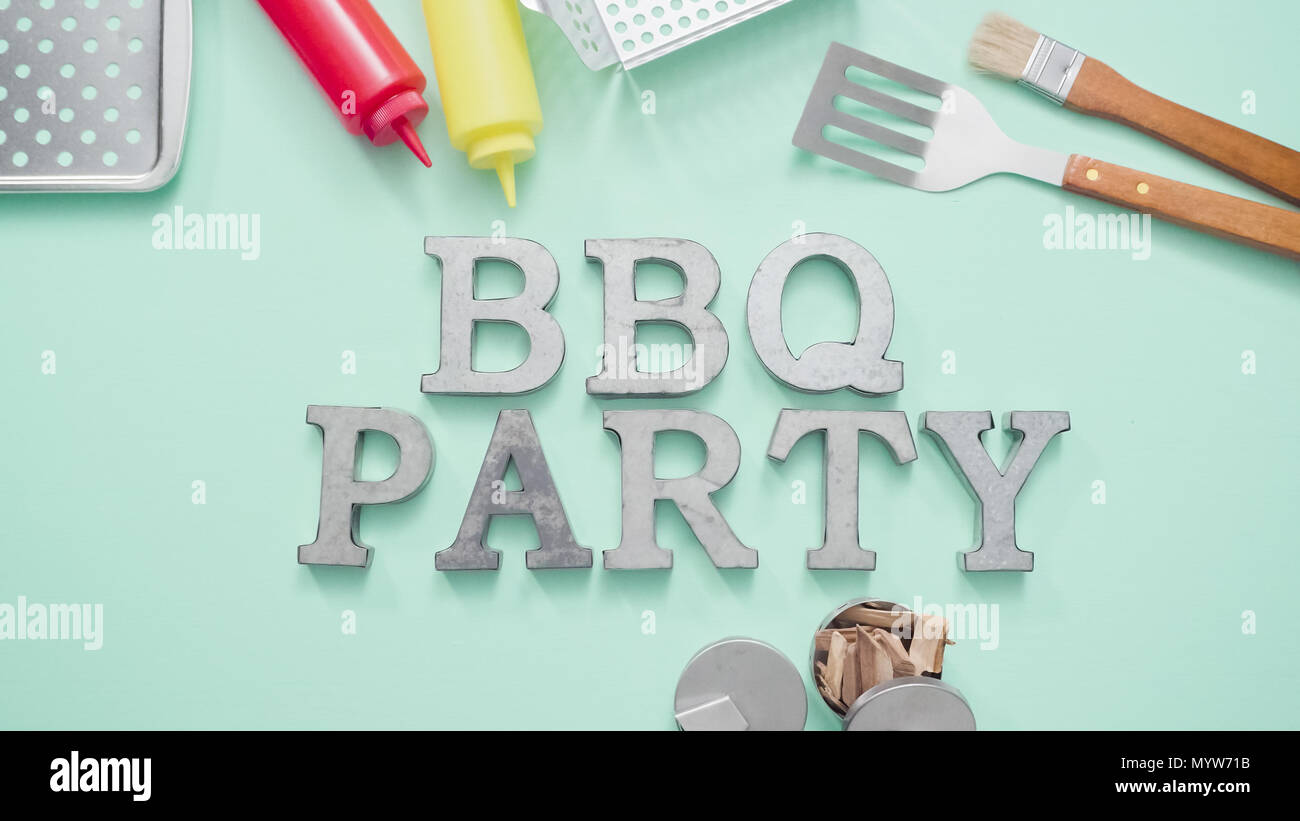 Metal BBQ Party sign with grilling tools on blue background Stock Photo ...