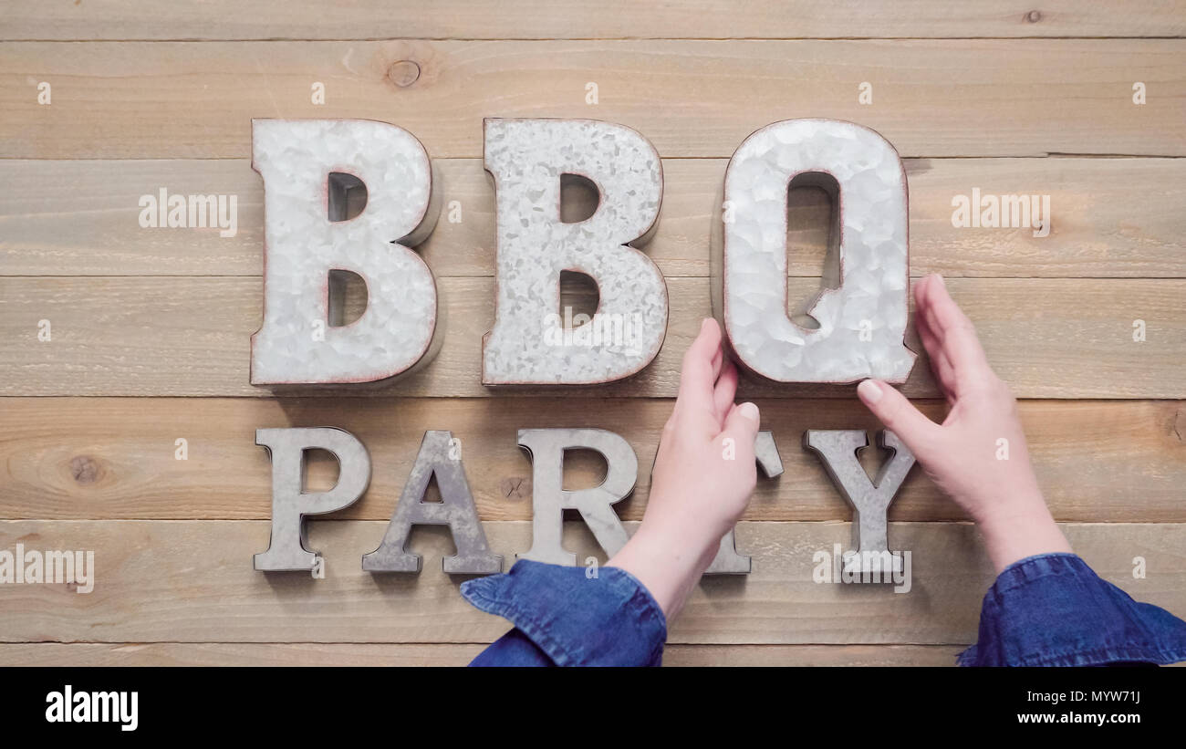 Metal BBQ Party sign with grilling tools on wood background Stock Photo ...