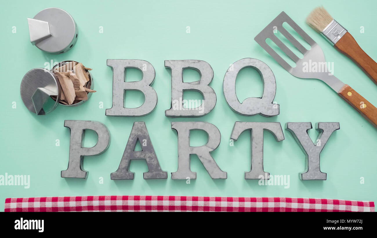 Metal BBQ Party sign with grilling tools on blue background Stock Photo ...