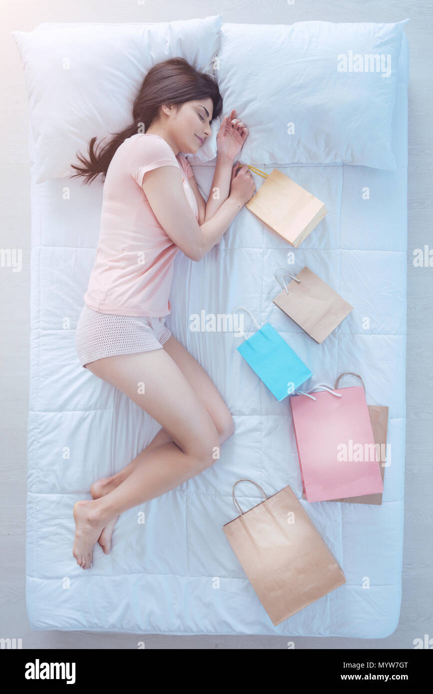 Exhausted lady falling asleep after shopping run Stock Photo - Alamy