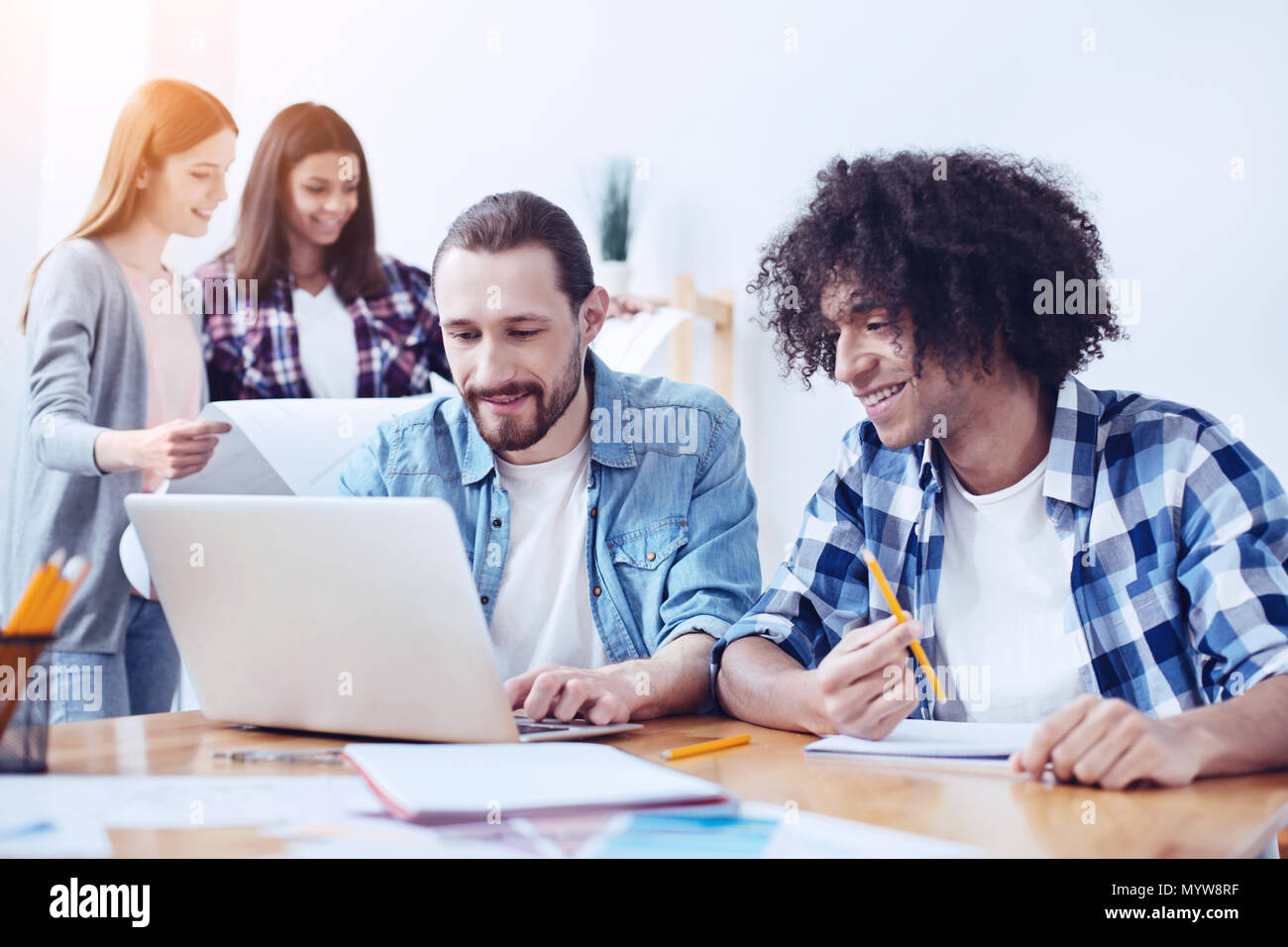 Positive friends enjoying social media hi-res stock photography and ...