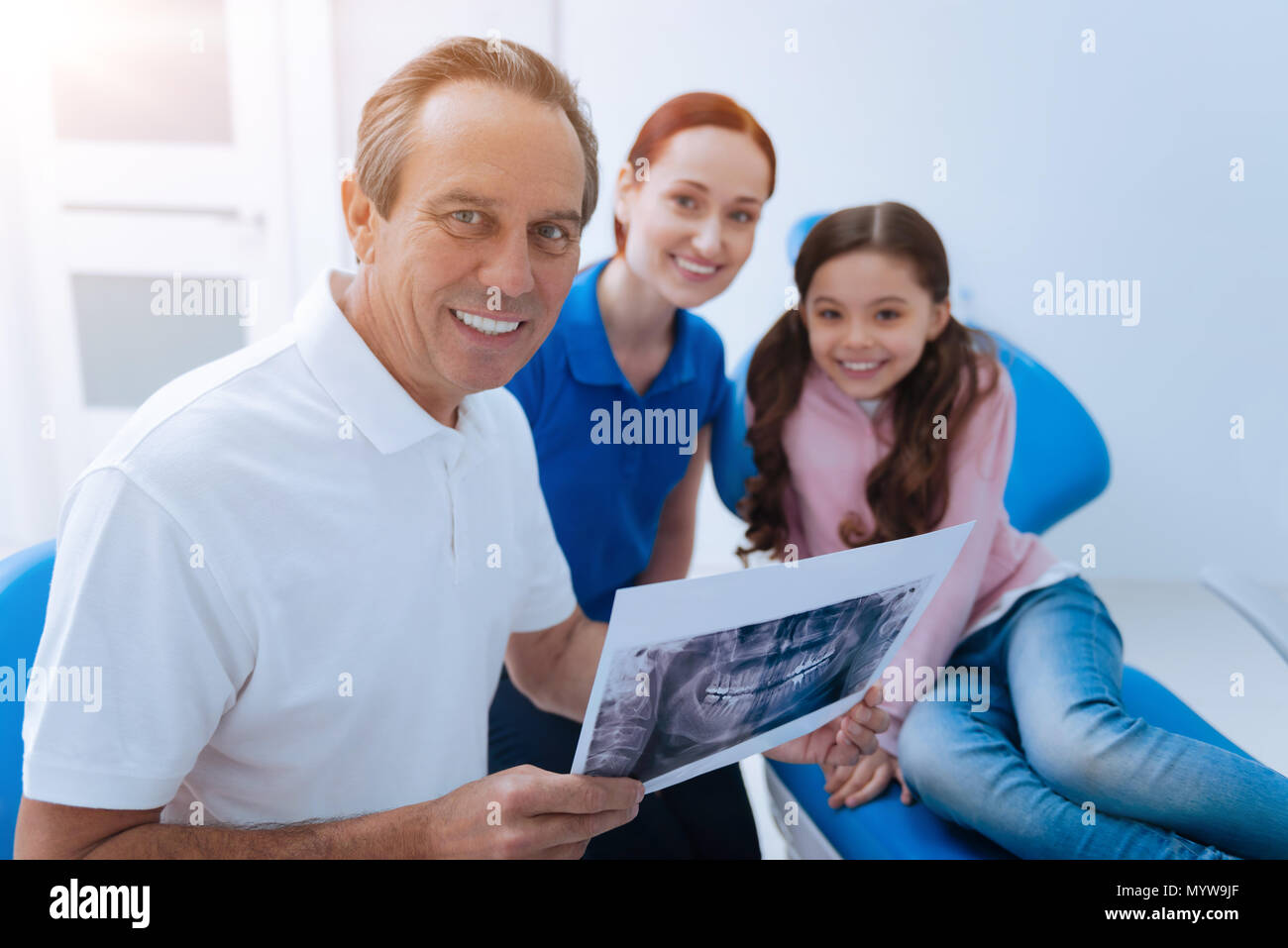 Handsome medical worker holding roentgen picture Stock Photo - Alamy