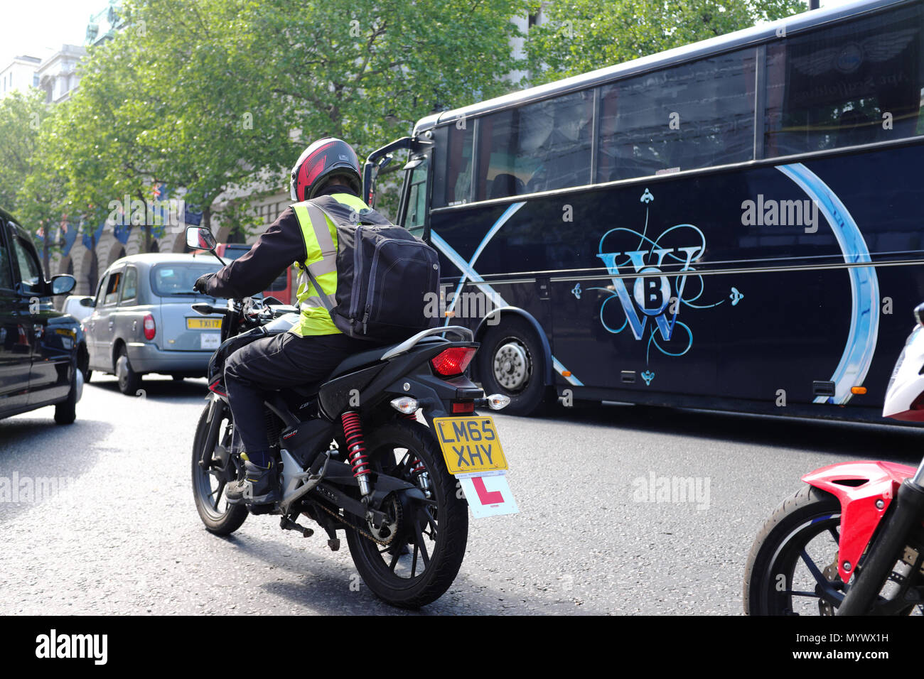 Motorcycling amongst Traffic, London, England, UK Stock Photo - Alamy