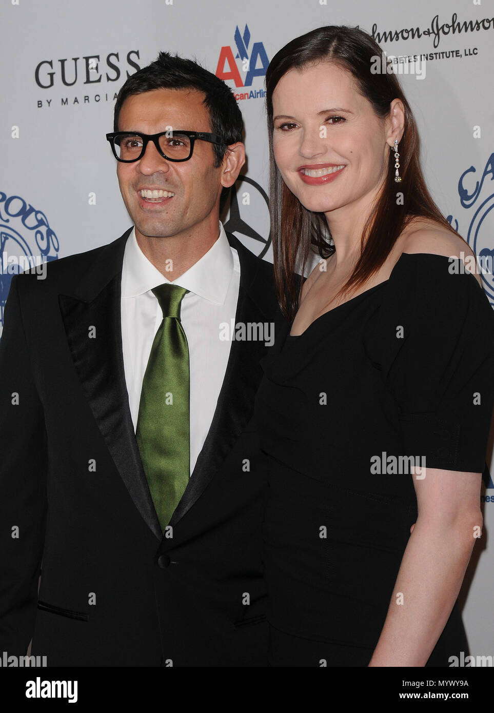 Geena Davis and husband Dr. Reza Jarrahy - Carousel Of Hope Benefit at ...