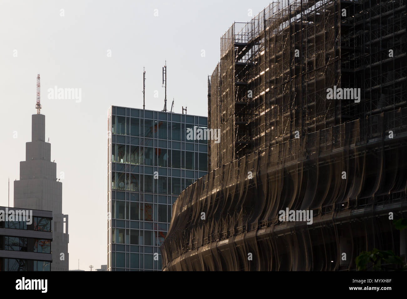 The distinctive NTT Docomo Tower seen behind the new National Stadium ...