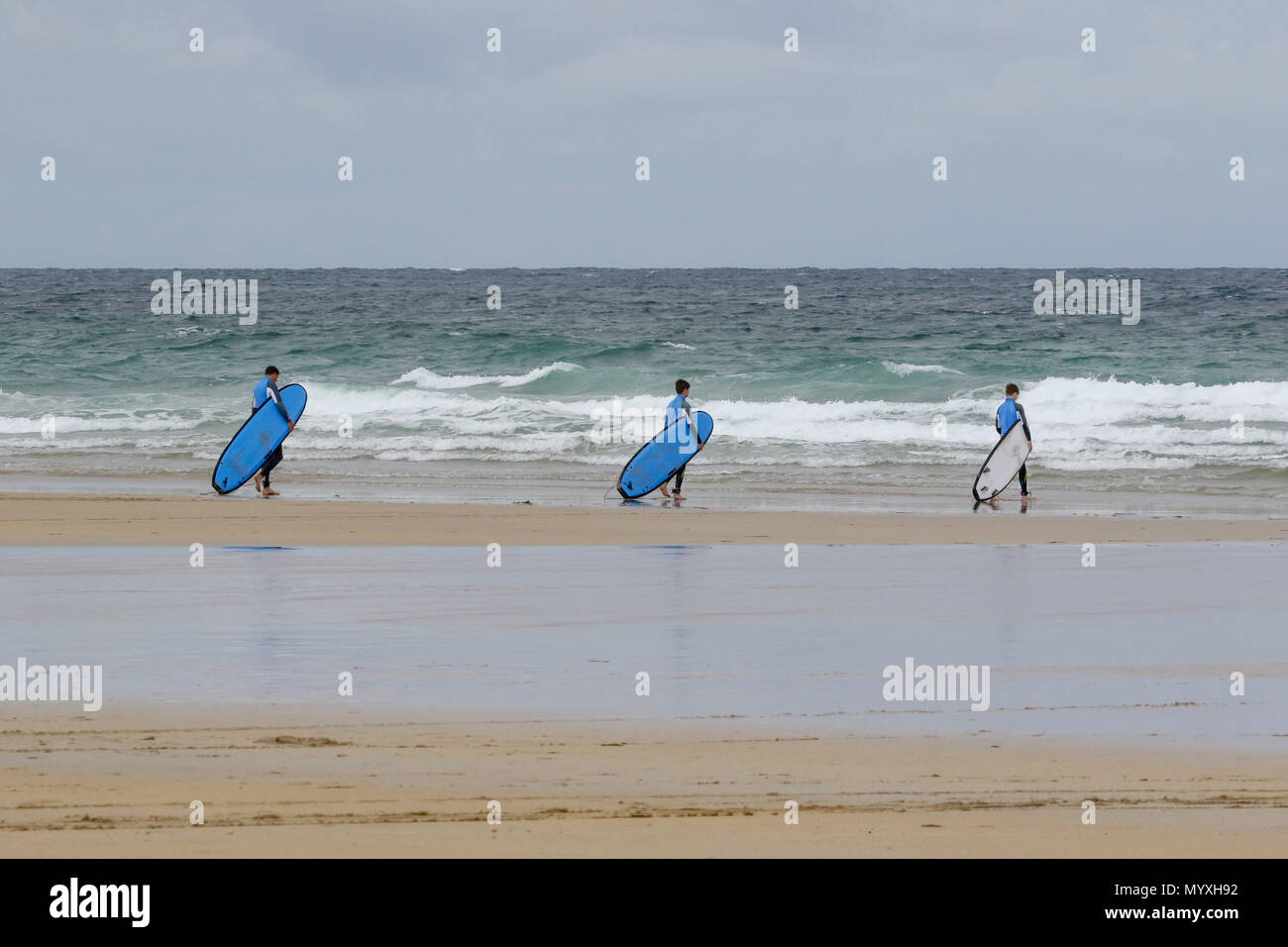 Walking on beach carrying surf board hi-res stock photography and ...