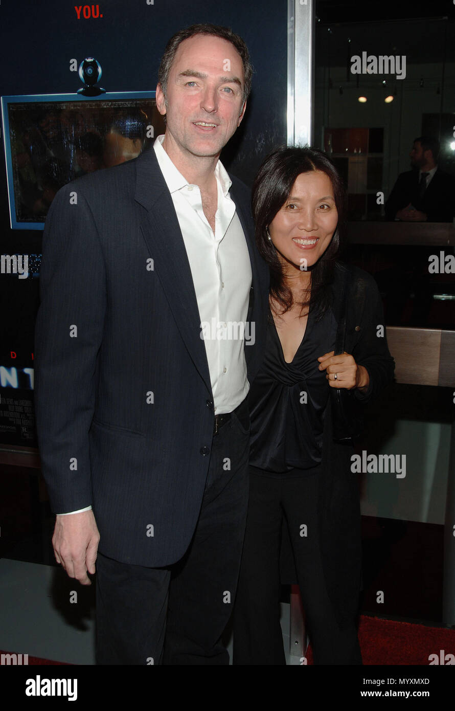 Peter Lewis and Joon Jin Jo arriving at the UNTRACEABLE Premiere at the ...