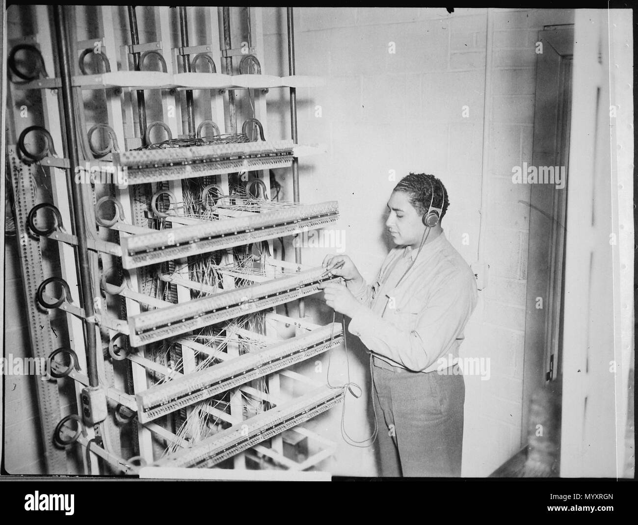 Marine Cpl. Robert L. Hardin...checks the main distributing frame in ...