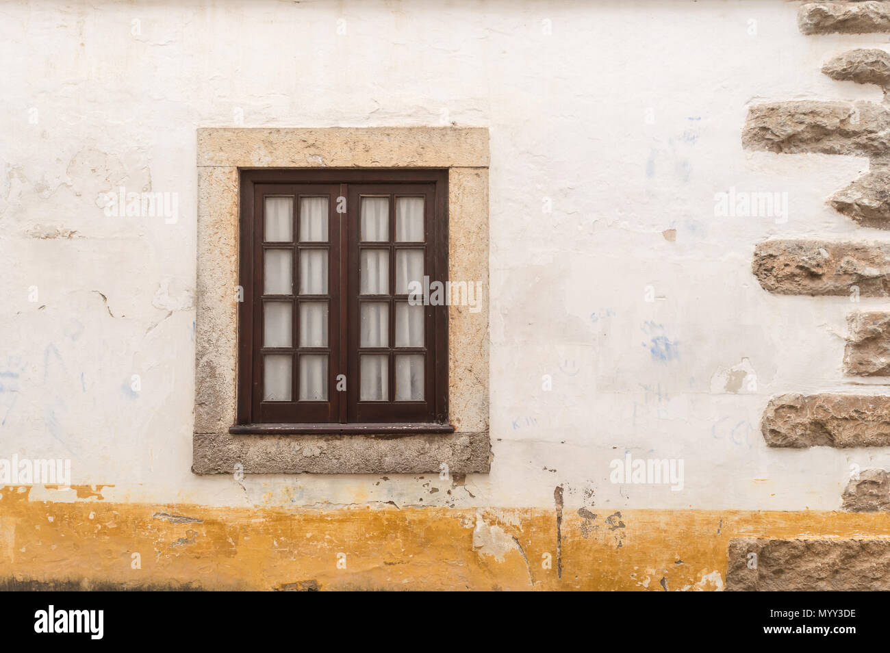 Closed window on a textured wall Stock Photo - Alamy