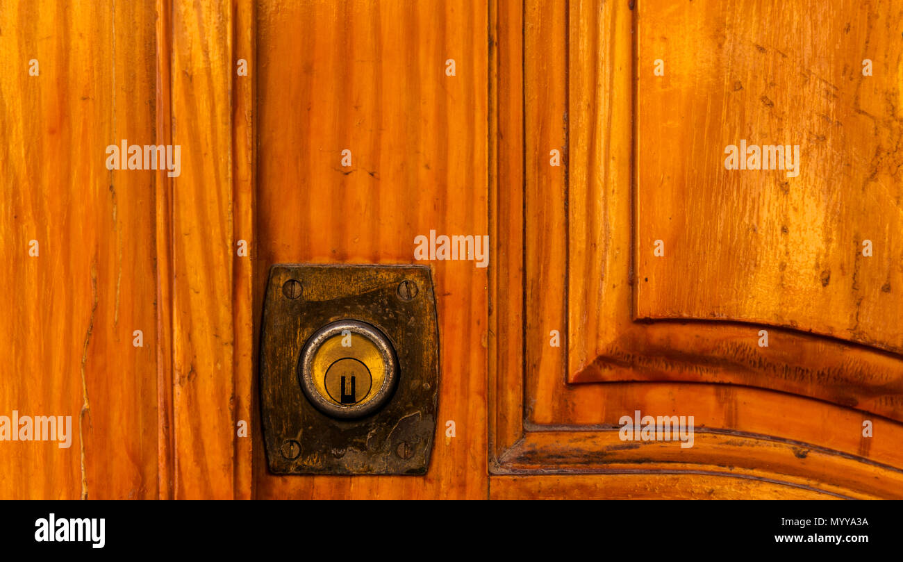 close up on the old lock with an interesting texture on the door, home ...