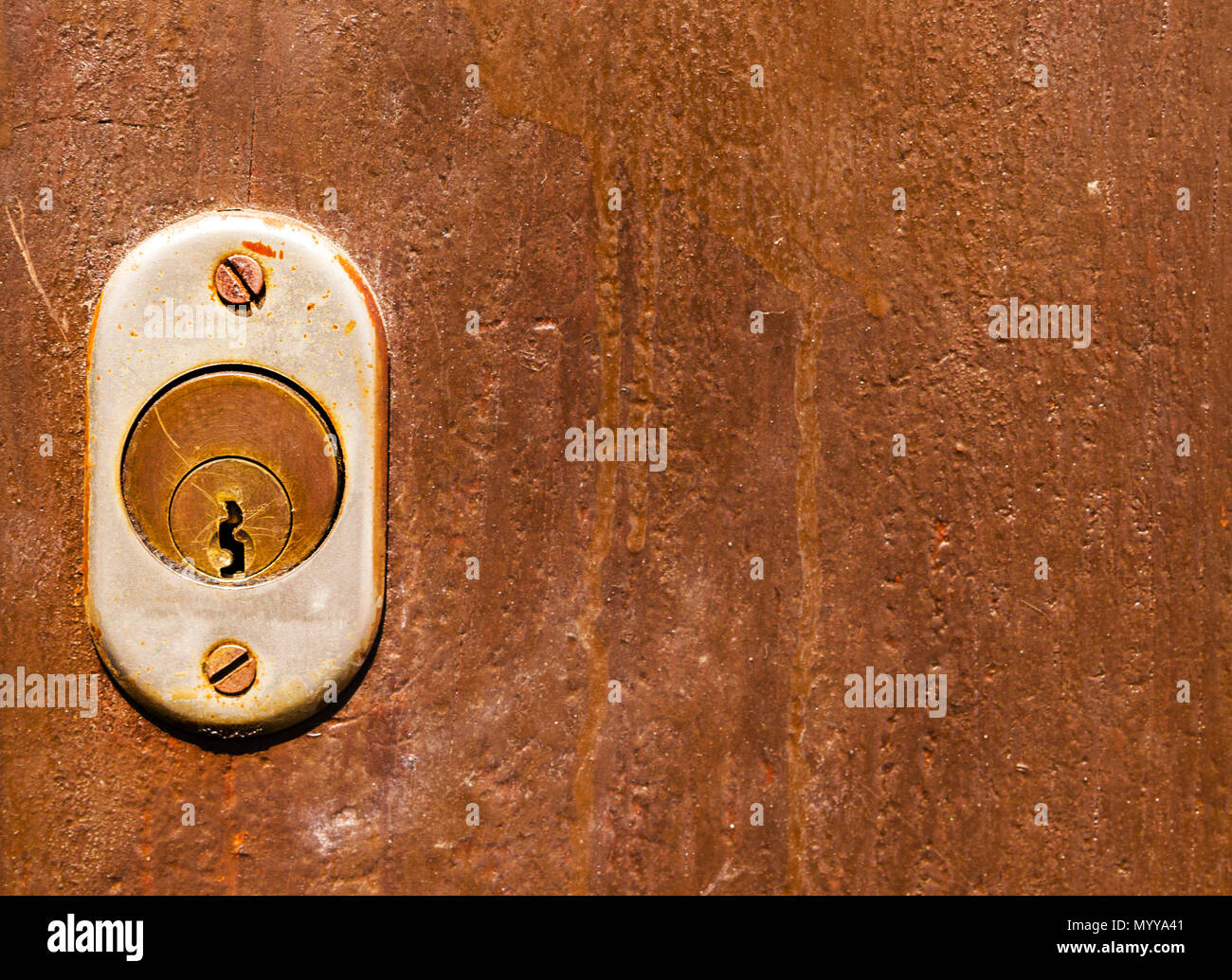 close up on the old lock with an interesting texture on the door, home ...