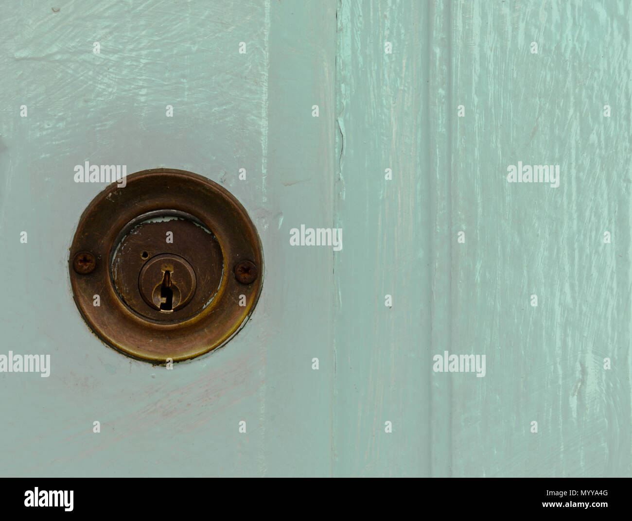 close up on the old lock with an interesting texture on the door, home ...