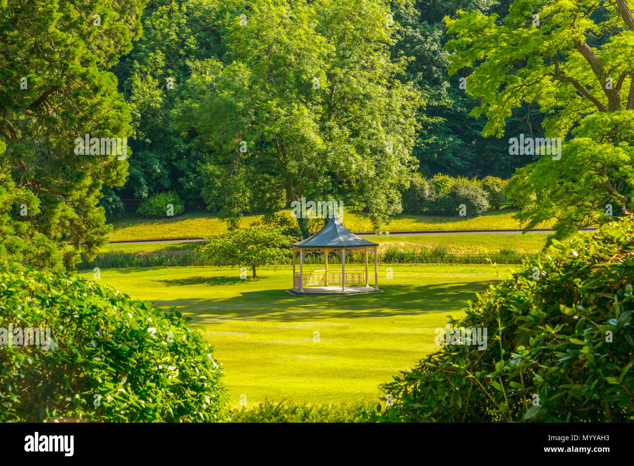 Beautiful park in antique style, stone decorations on pedestals ...