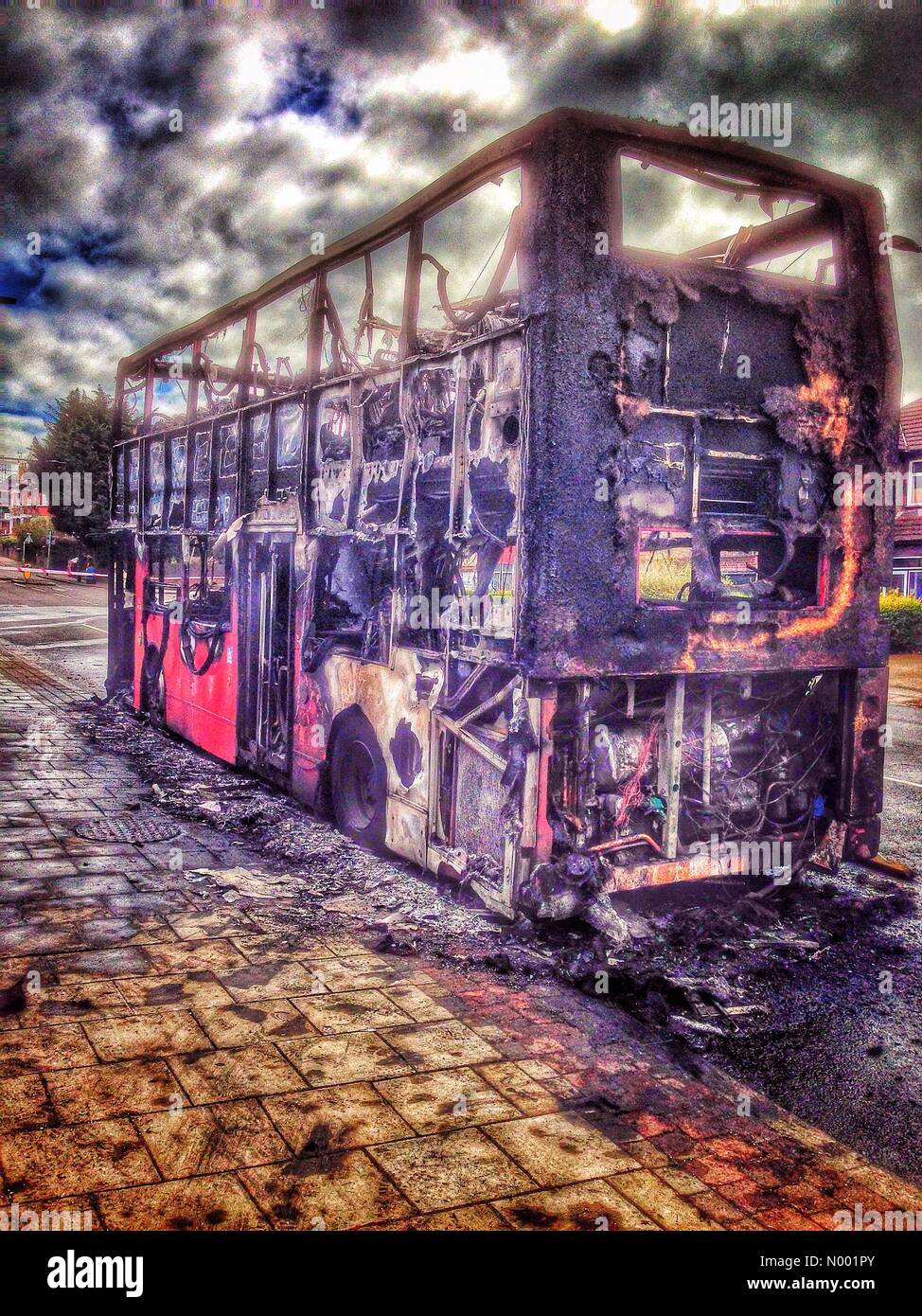 London, UK. 21st Mar, 2015. Burnt out bus in Forest Hill road, South ...