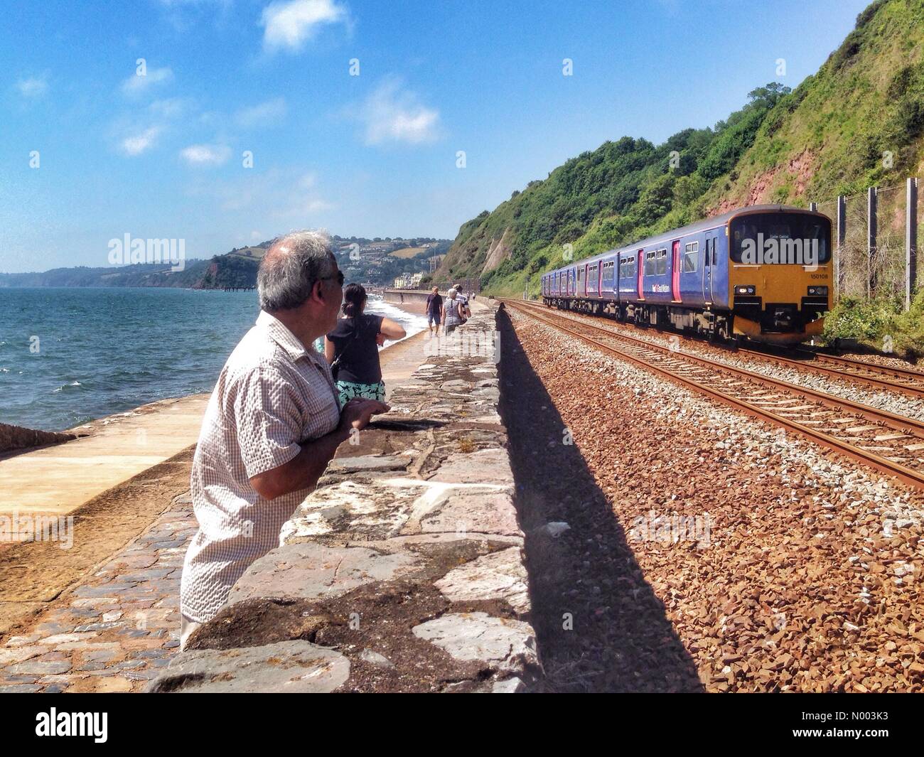 Trains running on coastal line at Teignmouth Stock Photo - Alamy
