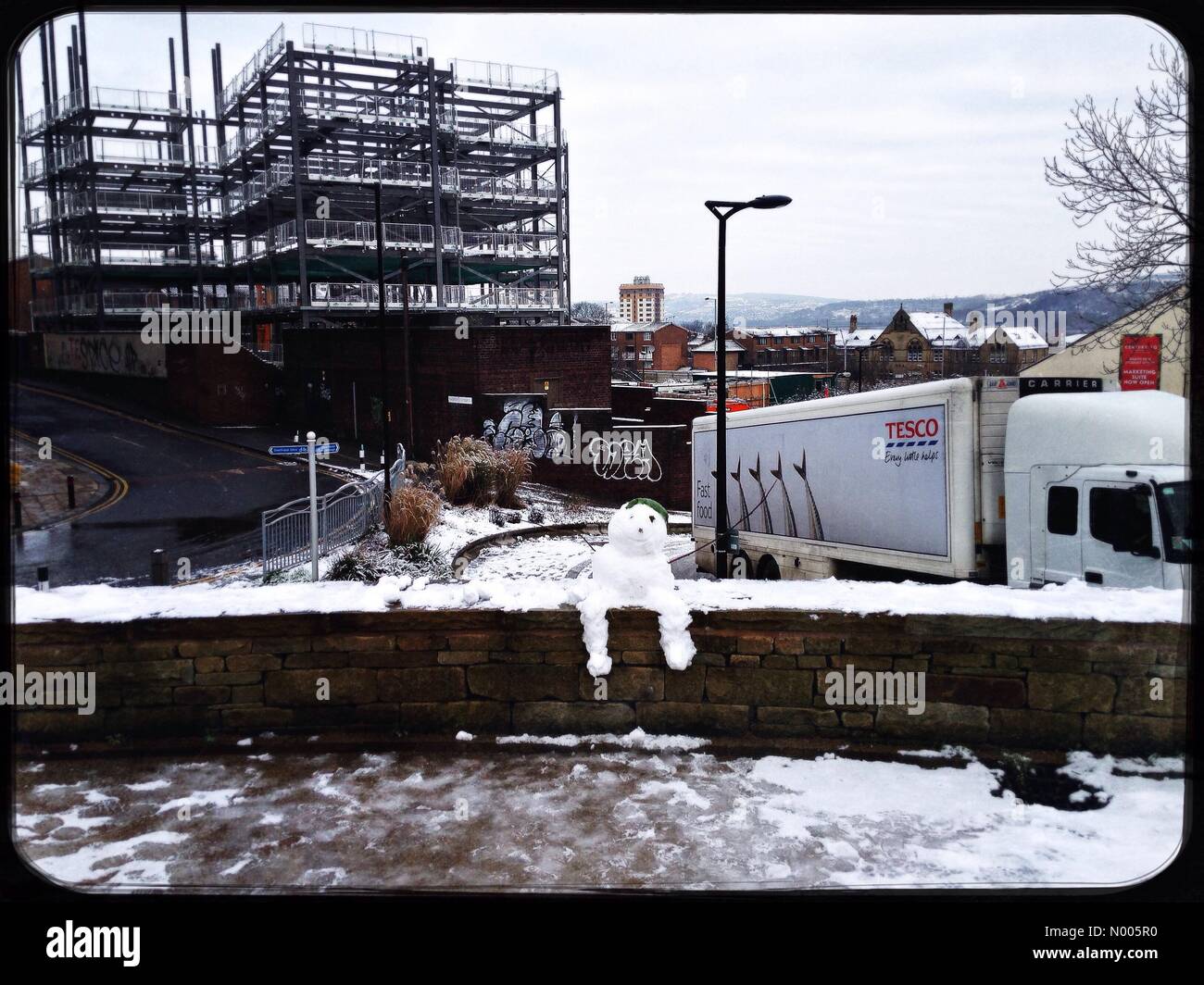 Snowman, industrial Sheffield landscape, melting snow, construction ...