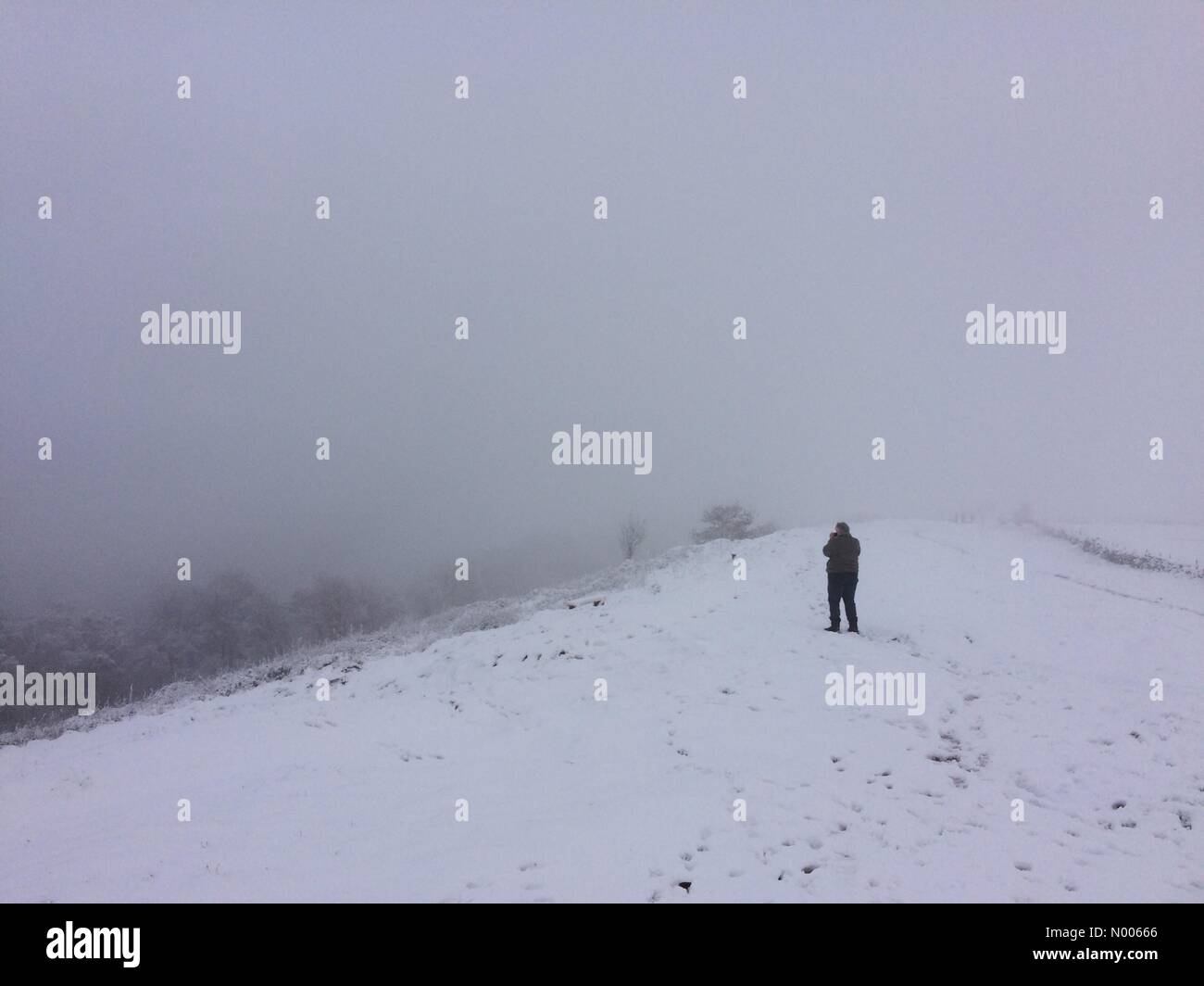Photographer in snow and fog on Otley Chevin Leeds West Yorkshire UK ...