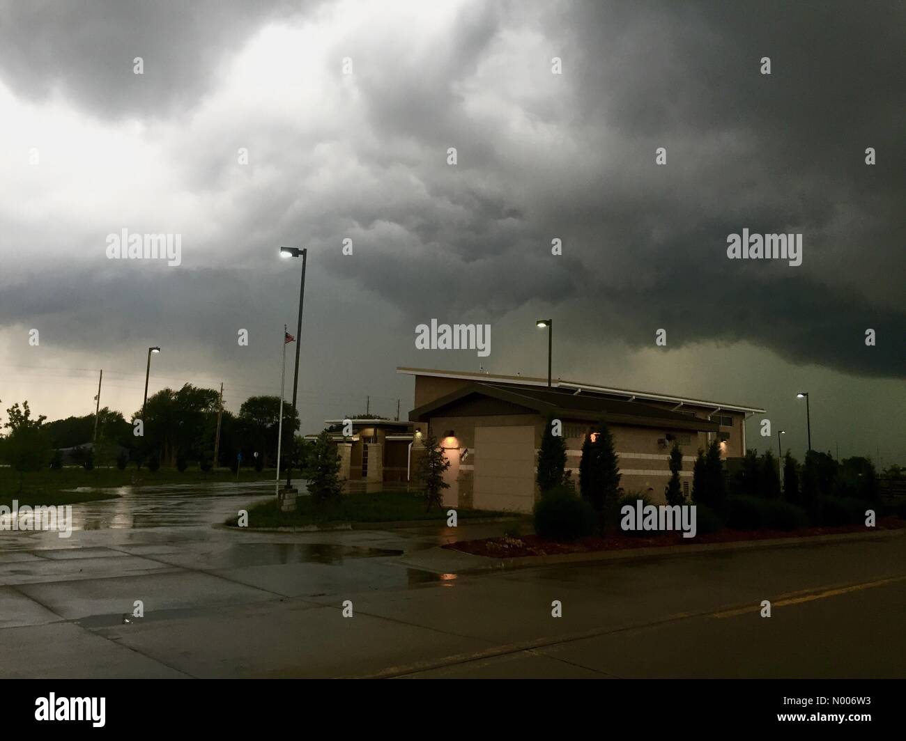 Peck, Kansas, USA. 26th Apr, 2016. A small funnel rotates overhead of ...