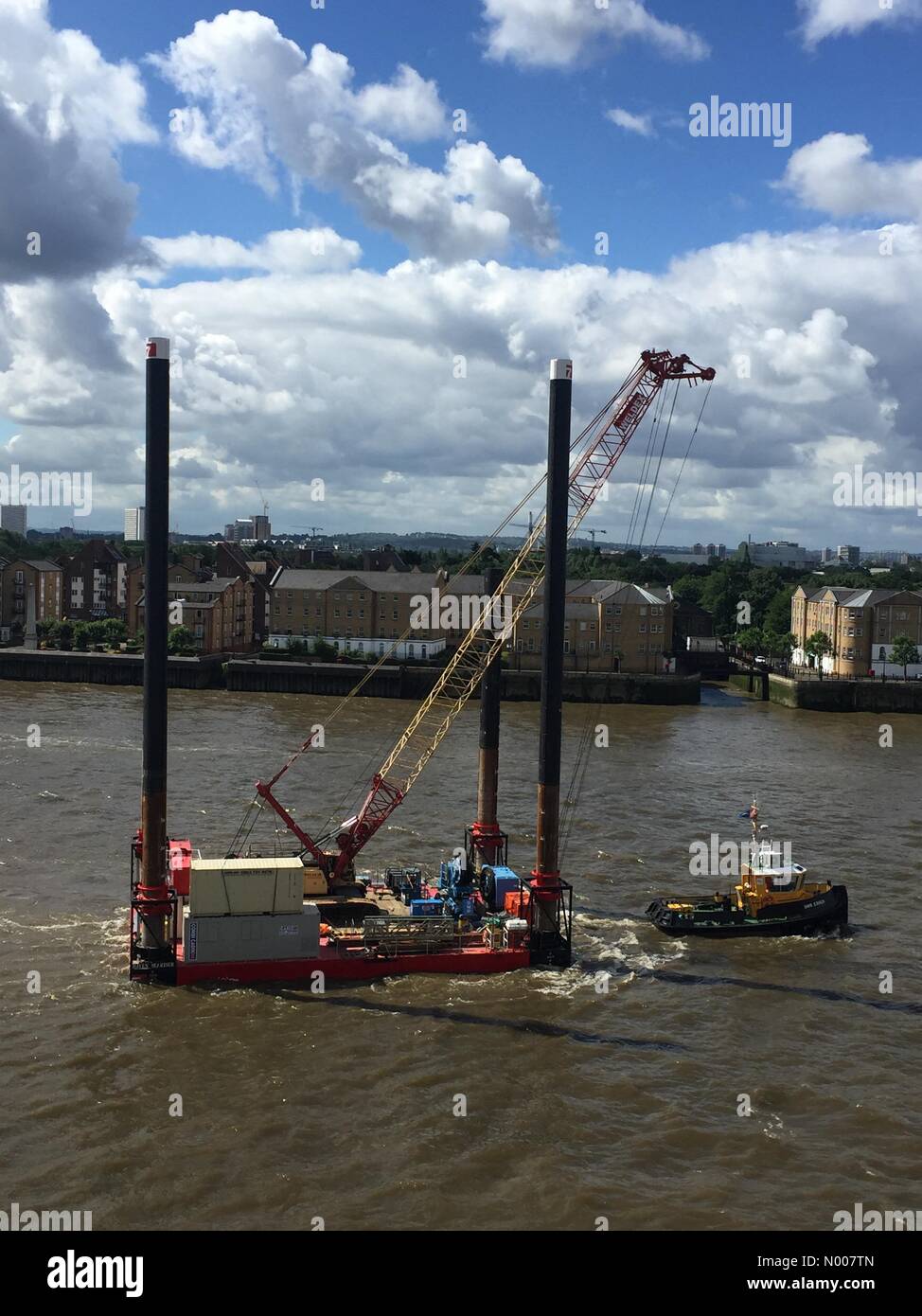 Giant, floating rig makes its way up-stream along the river Thames at ...