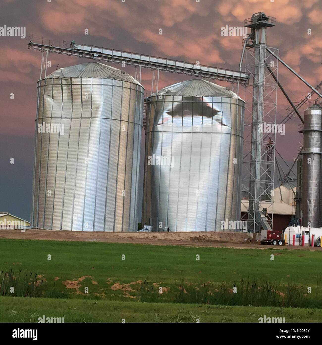 Elm Creek, Manitoba, Canada. July 20th, 2016. Wind damaged grain bins ...