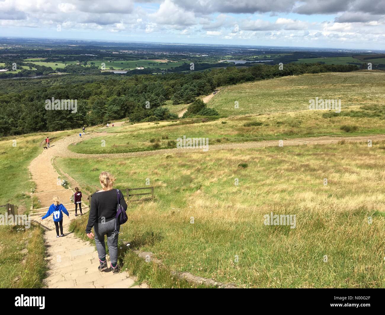 UK Weather: Sunny morning in Rivington. Family walking down from ...