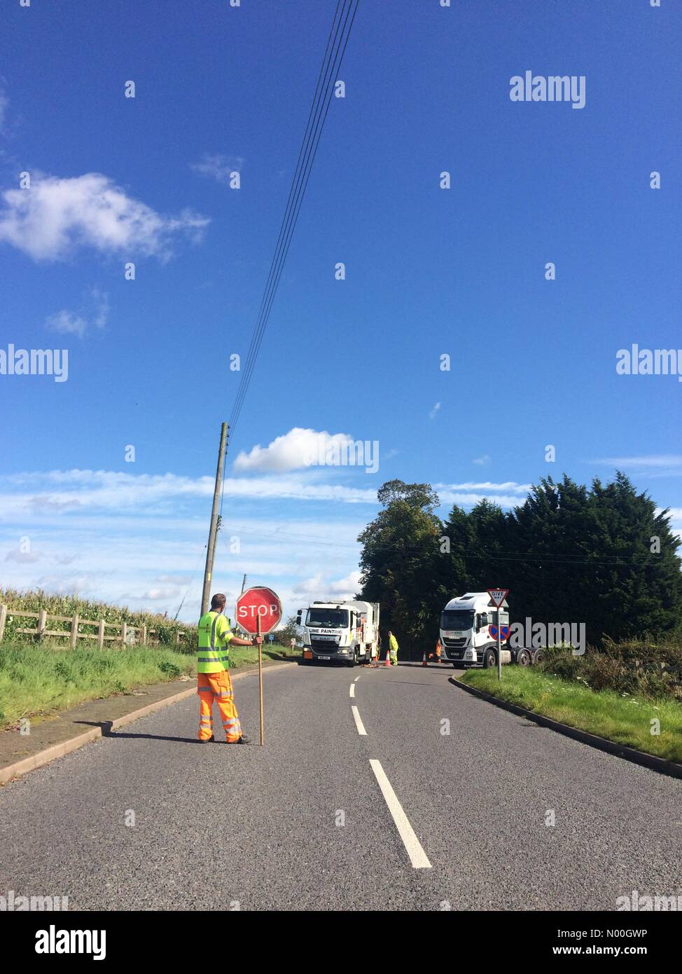 Stop sign for roadworks before junction Stock Photo - Alamy