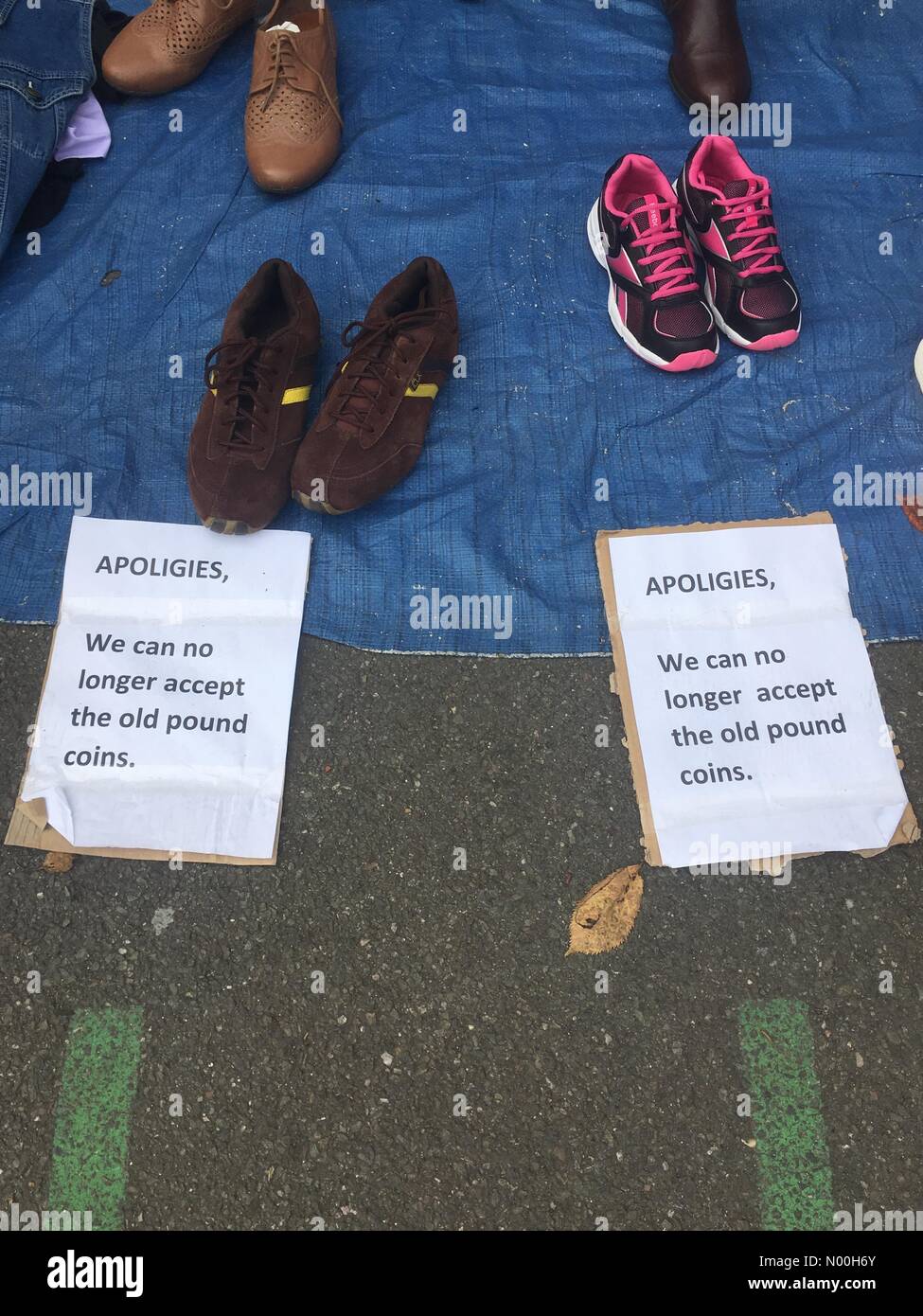 London, UK. 14th October, 2017. Street vendor place a sign on their ...