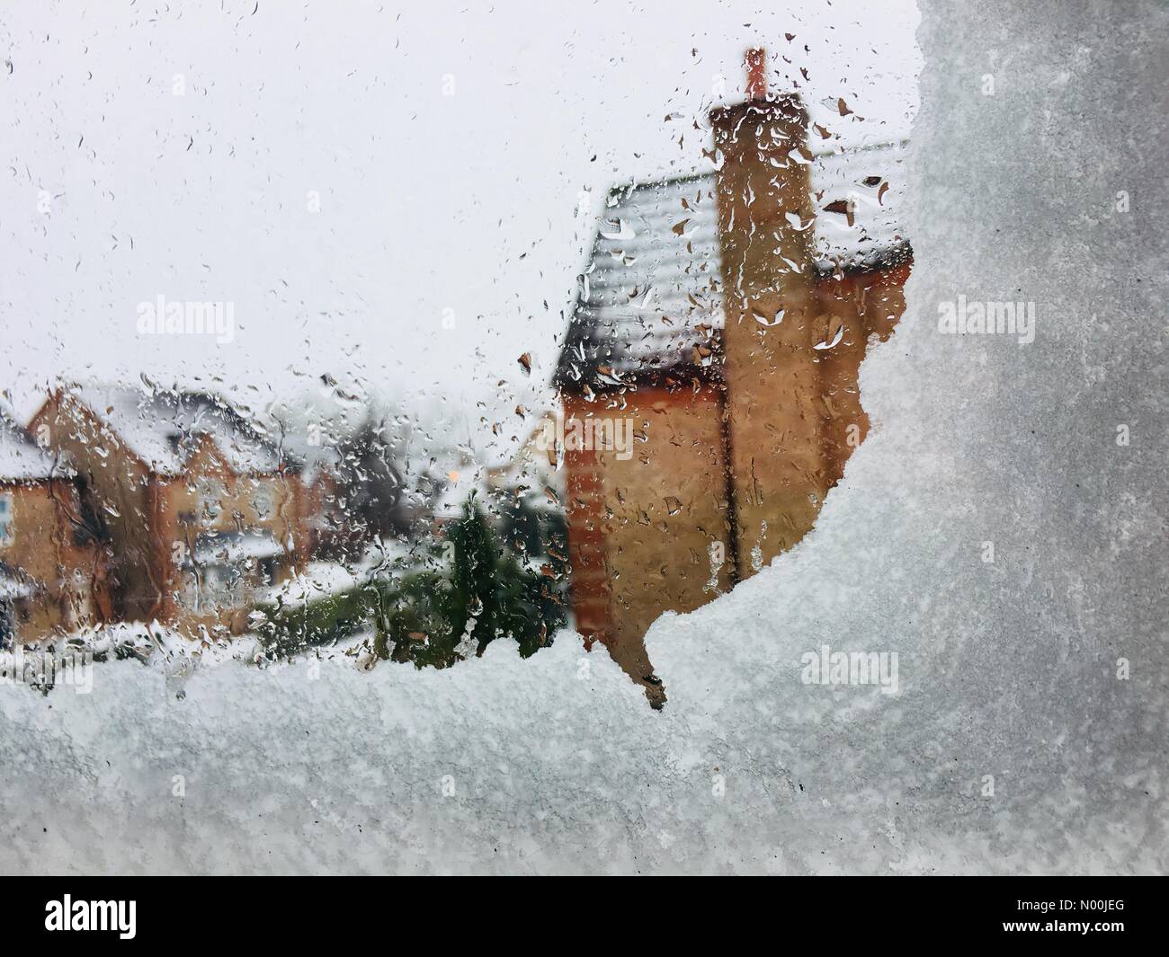 Snow collected on a glass window following early morning blizzard in ...