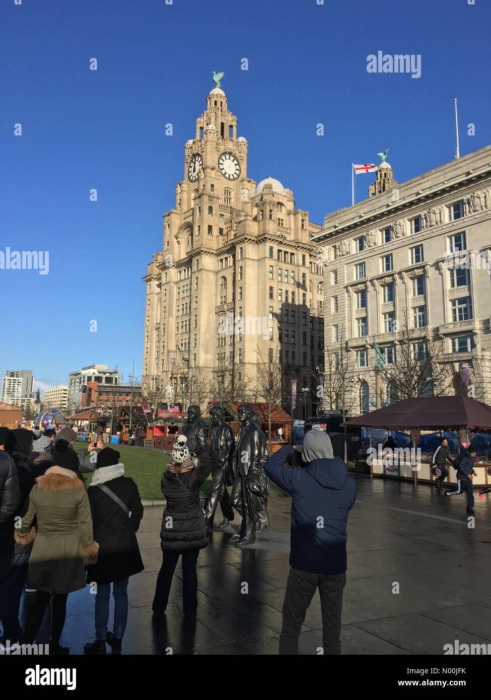 UK Weather: Sunny in Liverpool. Tourists and Beatles statues in front ...