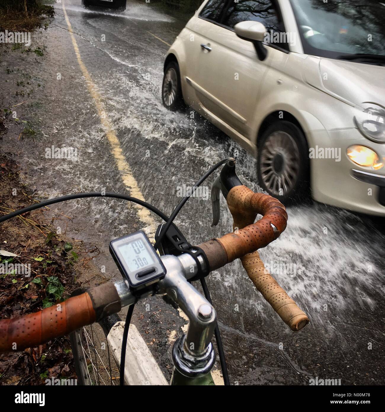 Cycle commute after heavy rain last night, through flooded roads Stock ...