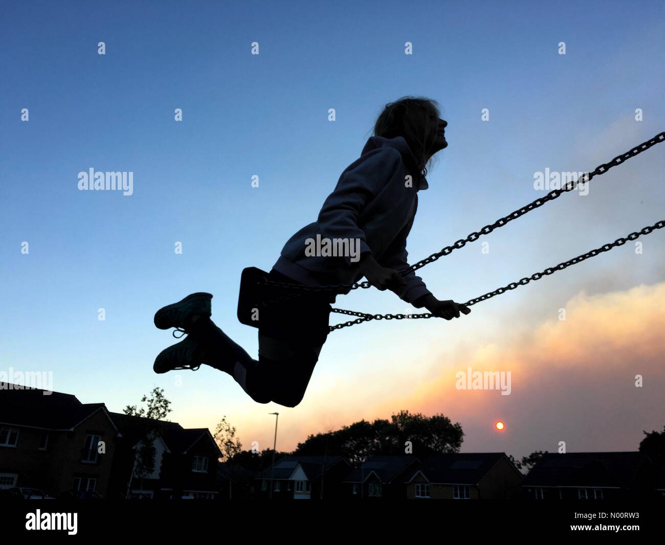 Swings in park hi-res stock photography and images - Alamy