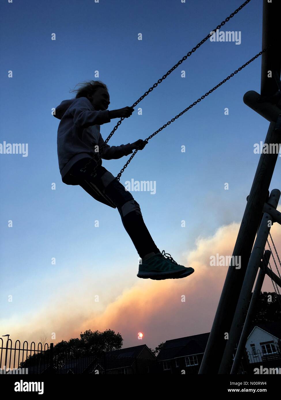 Swings in park hi-res stock photography and images - Alamy