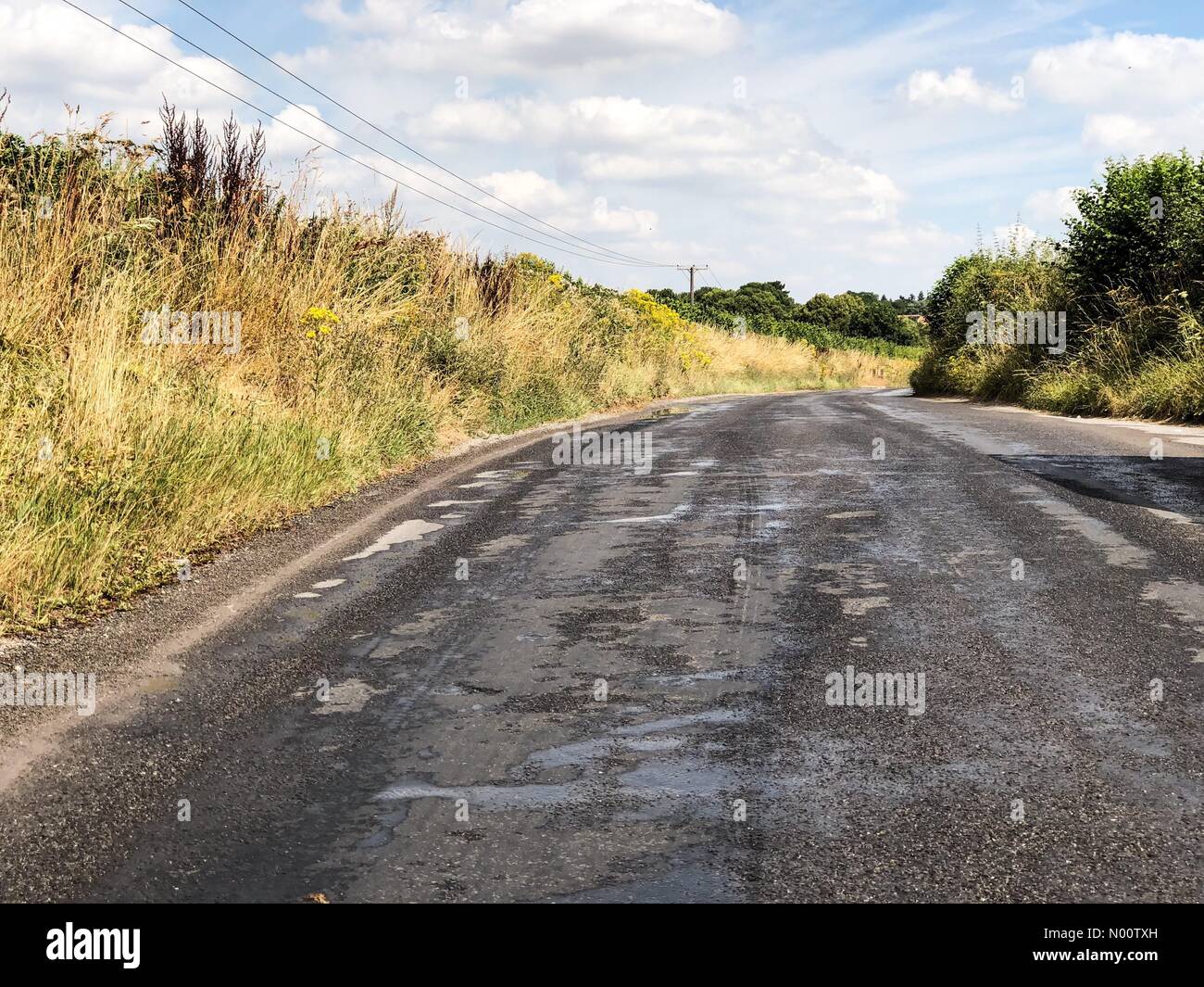 Melted tarmac heat hi-res stock photography and images - Alamy