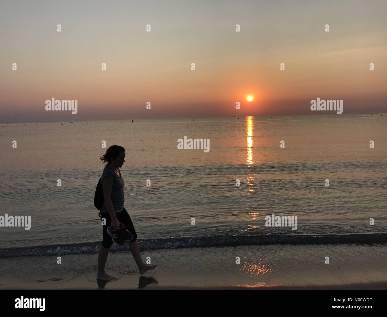 Spain : Weather, 05 August 2018 A woman walks on the beach on the Costa ...