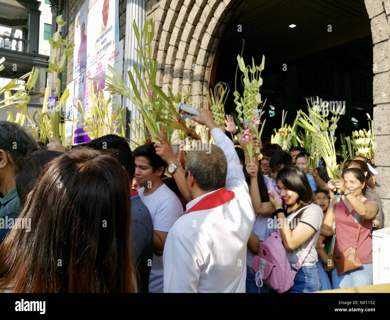 Quezon City, Philippines. Filipino Catholics bring their palm fronds ...