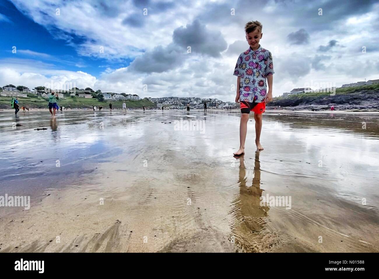 UK Weather: Foreboding sky reflected on Polzeath beach in Cornwall ...