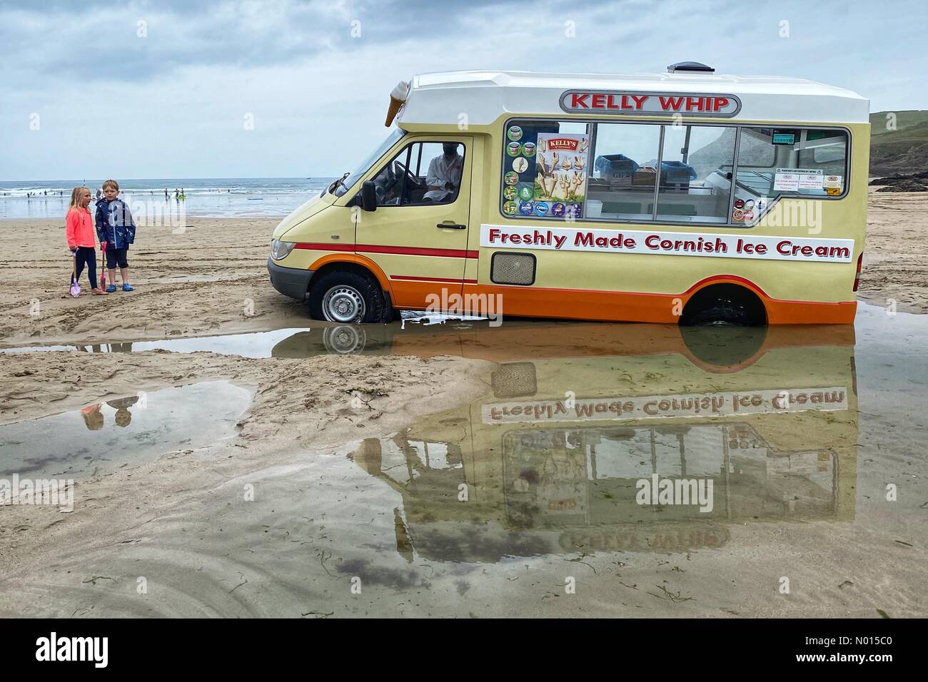 Devon, UK. July 29 2021: UK Weather: Stuck ice cream van in sand as ...
