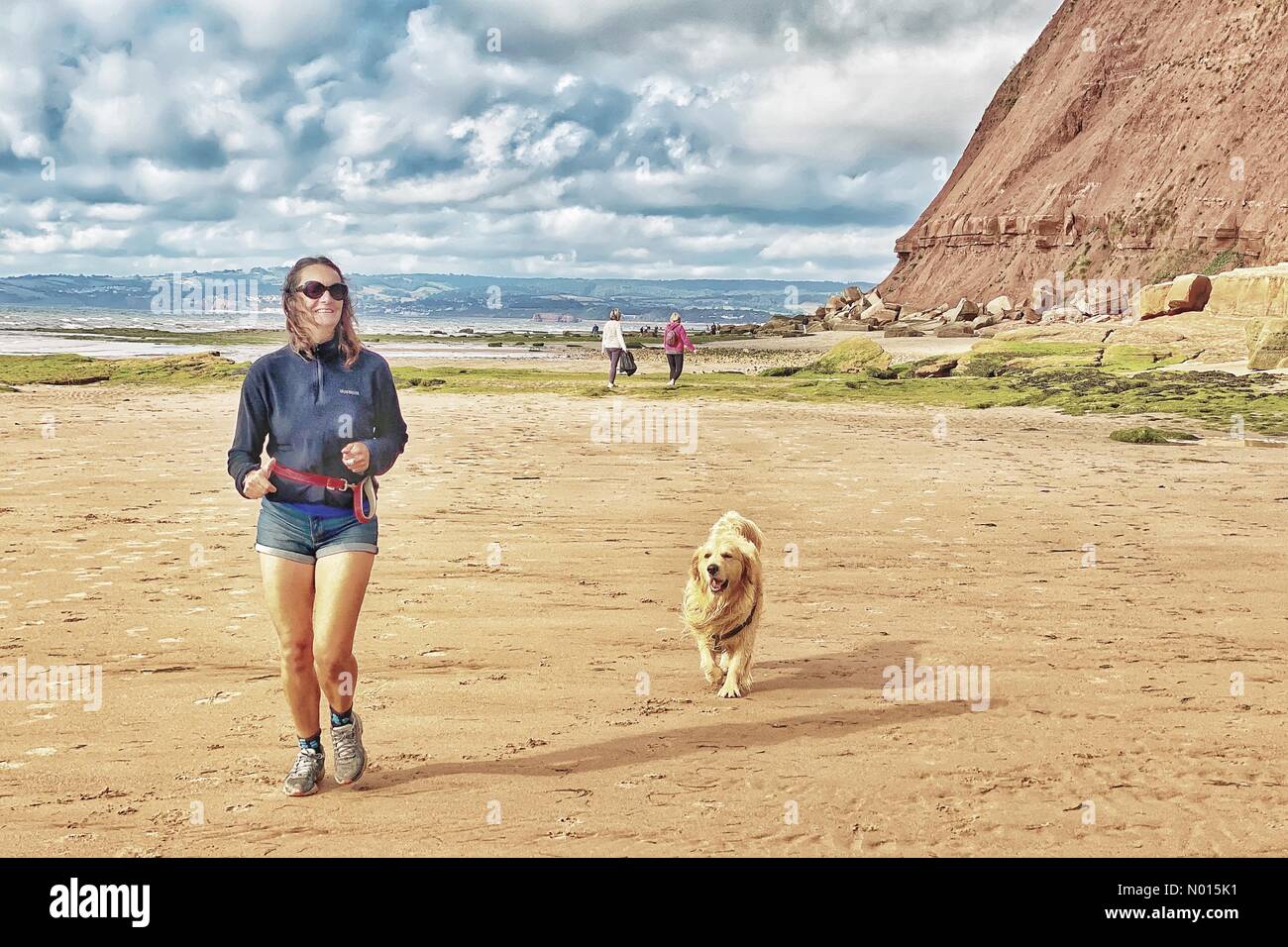 Exmouth beach, Devon, UK. Pictured: Raphael the retriever and Raich ...