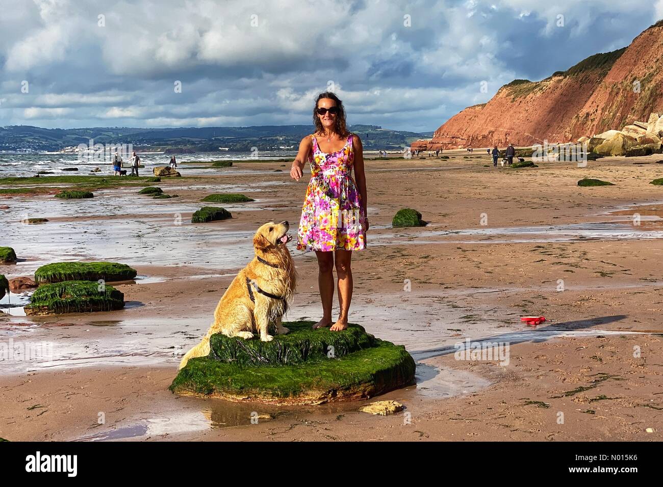 Exmouth beach, Devon, UK. Pictured: Raphael the retriever and Raich ...