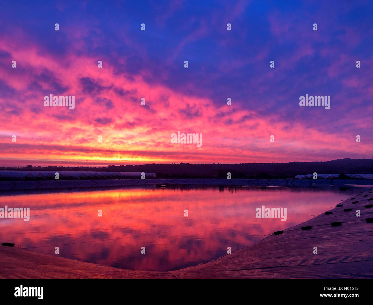 UK Weather: Sunrise over Godalming. Tuesley Farm, Godalming. 18th ...