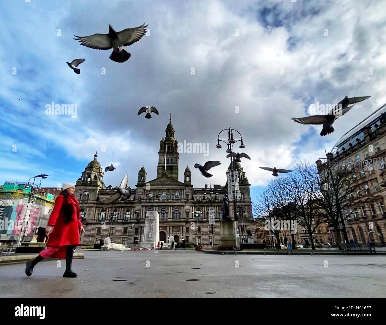 Pigeons fly over George Square in Glasgow, Scotland, UK. 19th February ...