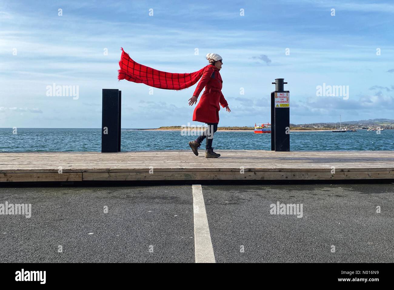 UK Weather: Raich Keene battles strong winds in Exmouth, Devon, UK. 7th ...