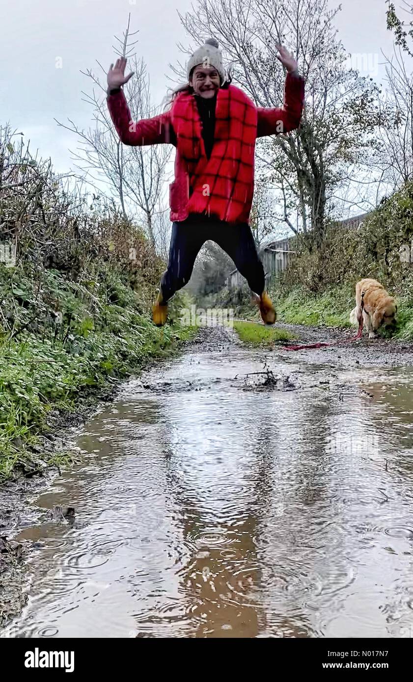 UK Weather: Raich Keene and Raphael the retriever puddle stompin' on a rainy walk. Lower Ashton ...